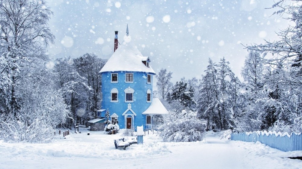 Winter Wonderland: A Blue House in Finland's Snowfall