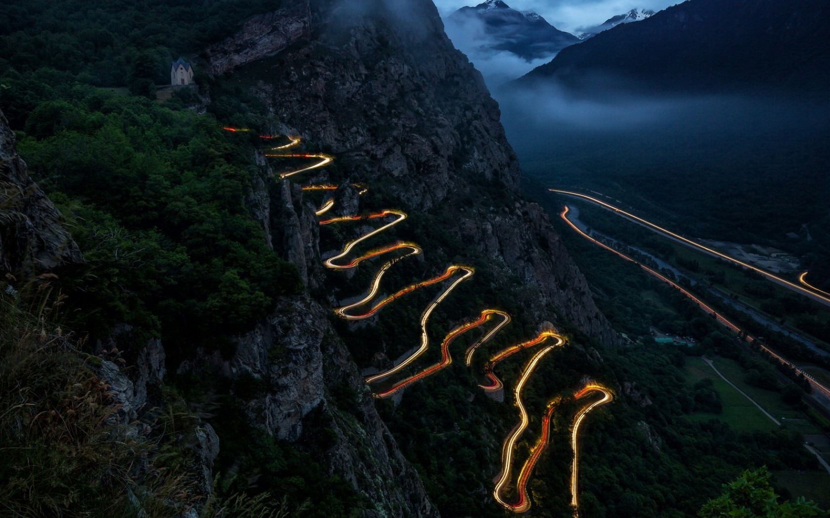 Nighttime Time Lapse: A Man-Made Road Through Mountain Landscapes