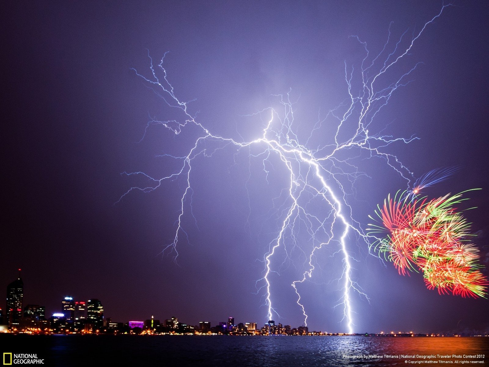 Electric Symphony: Capturing Lightning’s Dance Over the City Lights