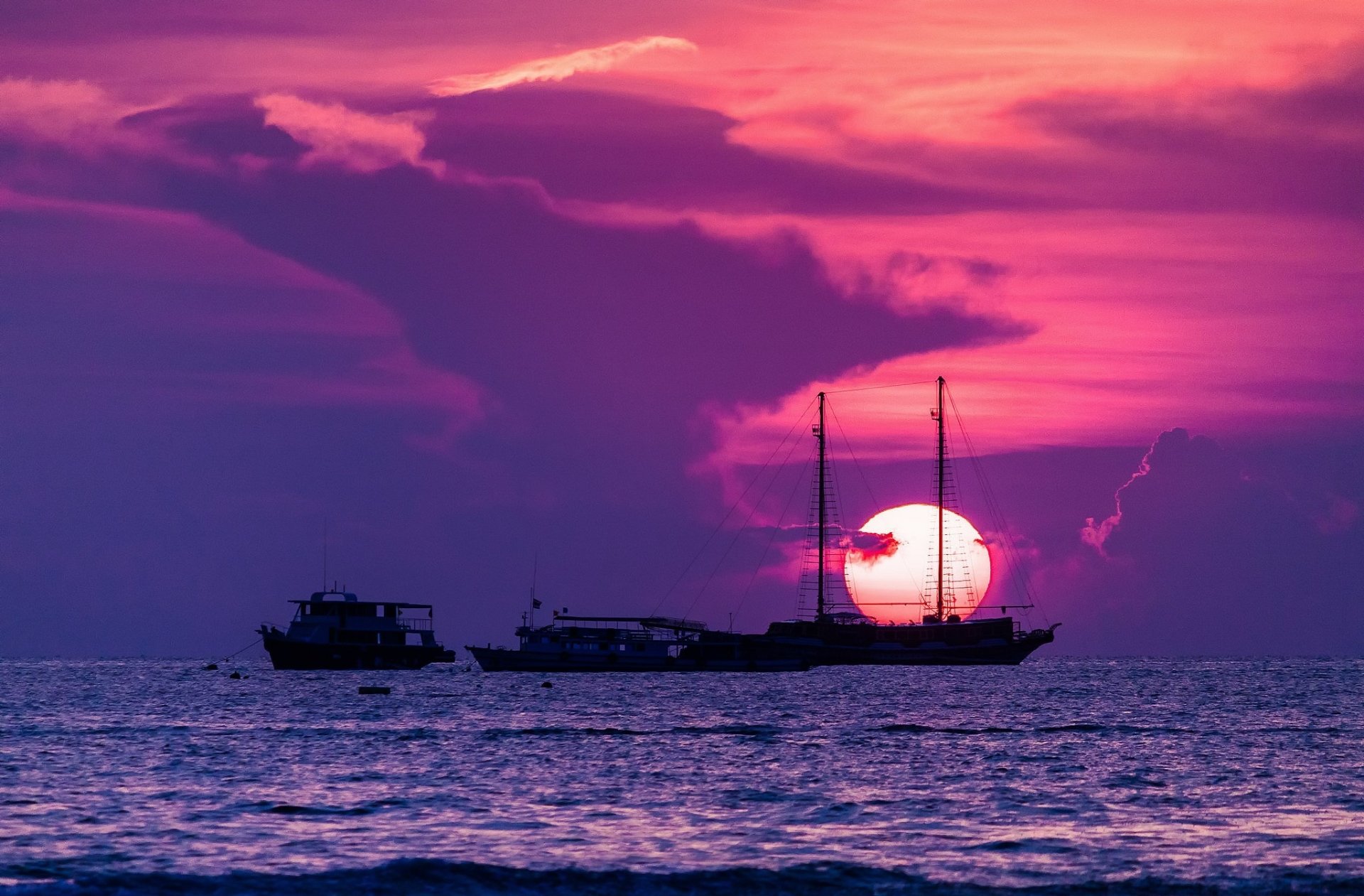 Serene Sunrise Sail: Capturing Dawn's First Light Over the Ocean