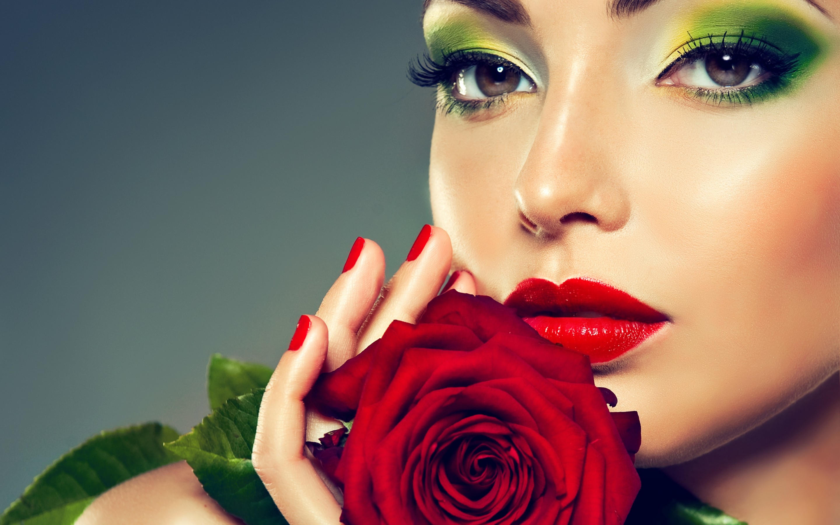 Radiant Woman’s Face with a Blooming Red Rose