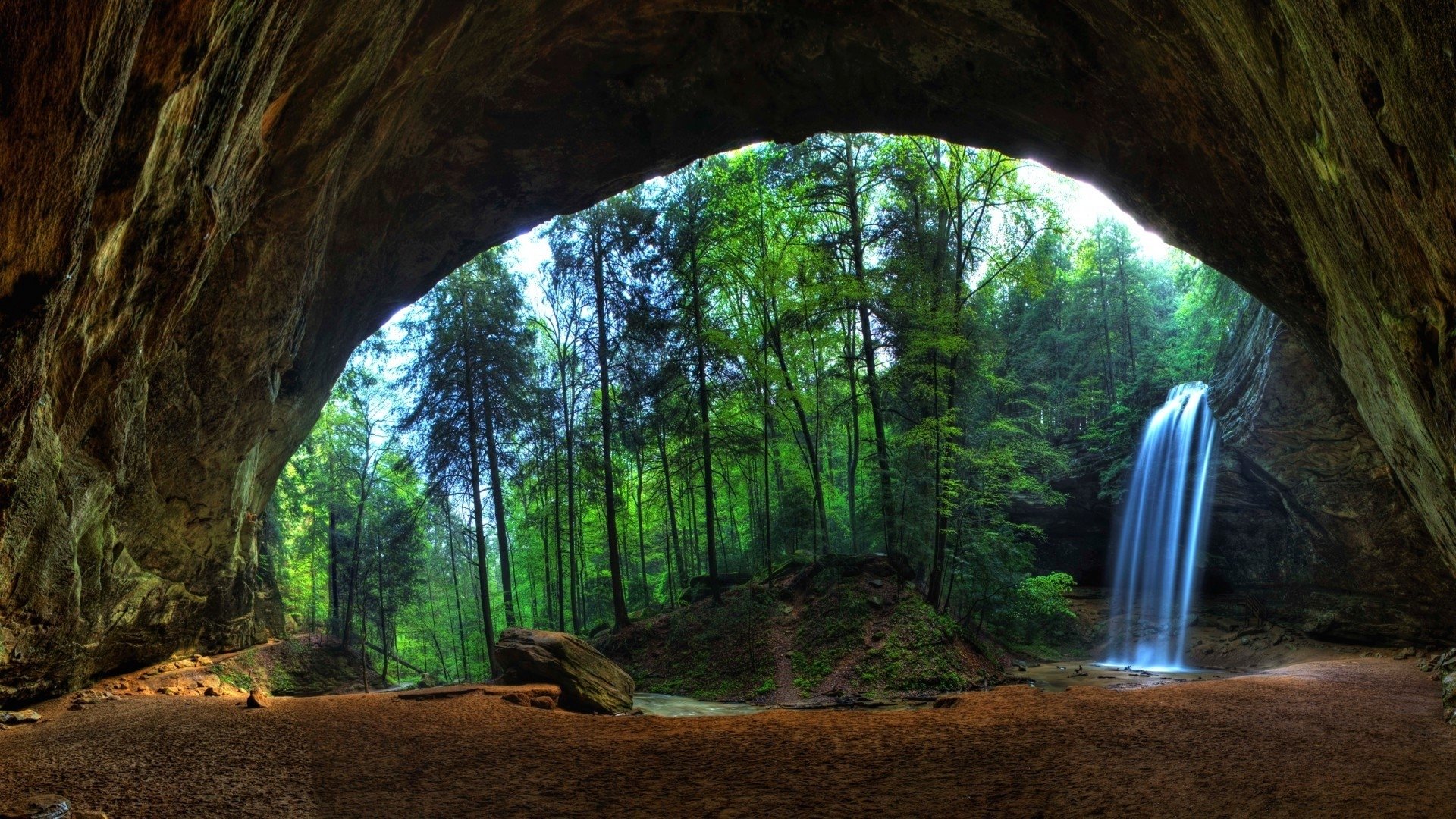 Serenity of Nature: Waterfall in a Mystical Cave Forest
