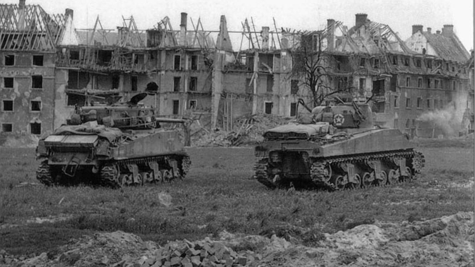 M4 Sherman Tanks in a War-Torn Landscape