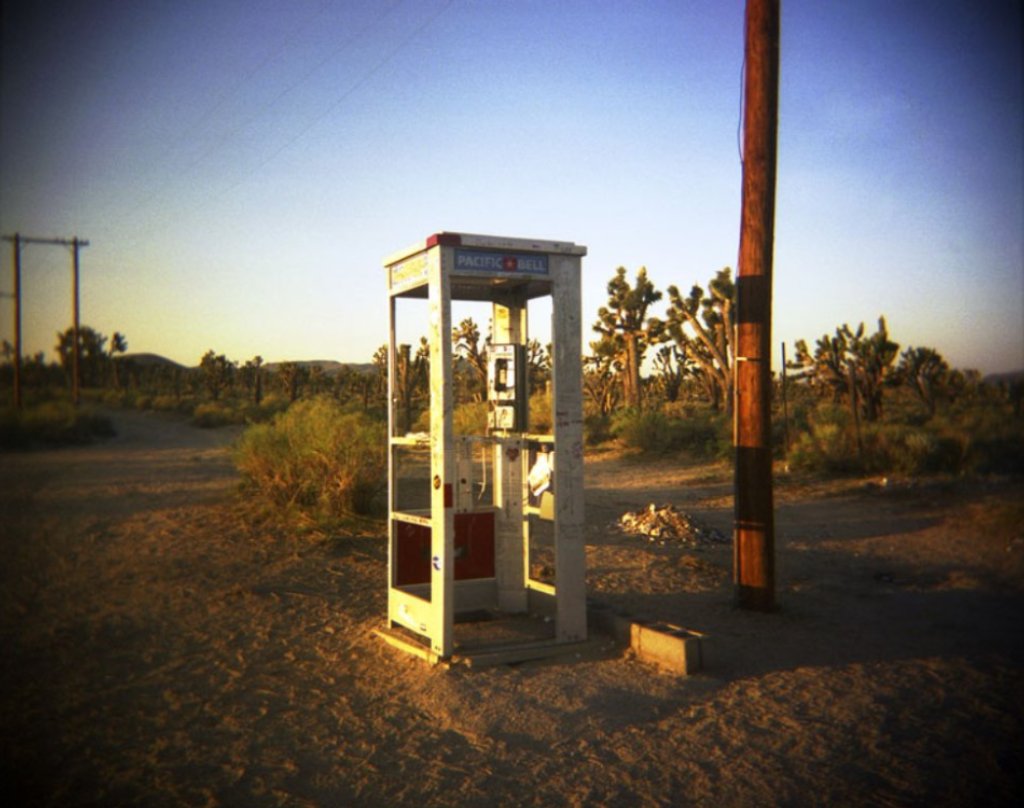 Lonely Telephone Booth in a Desert Landscape