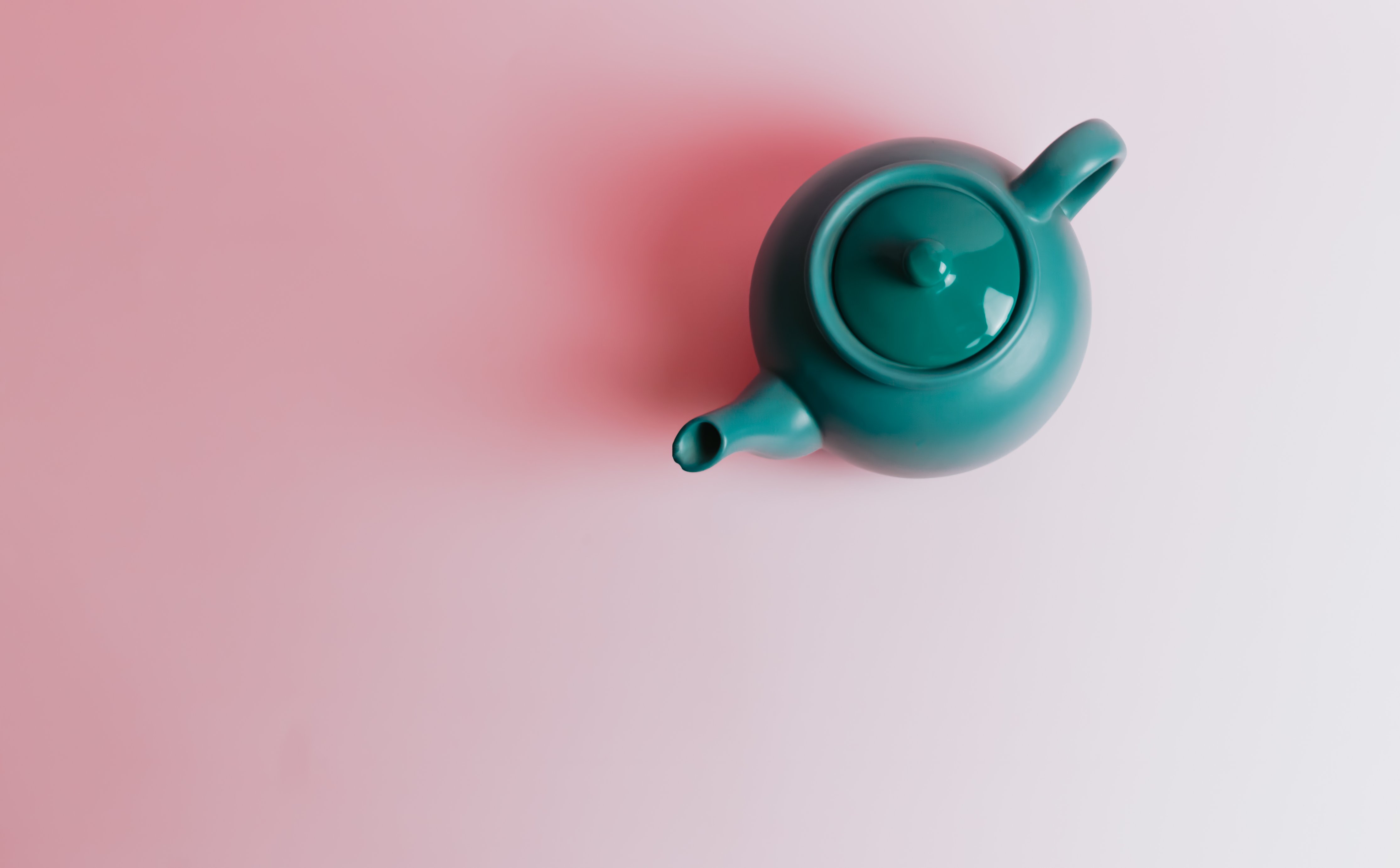 Top View Of A Green Teapot On A Pink Background - Image Abyss