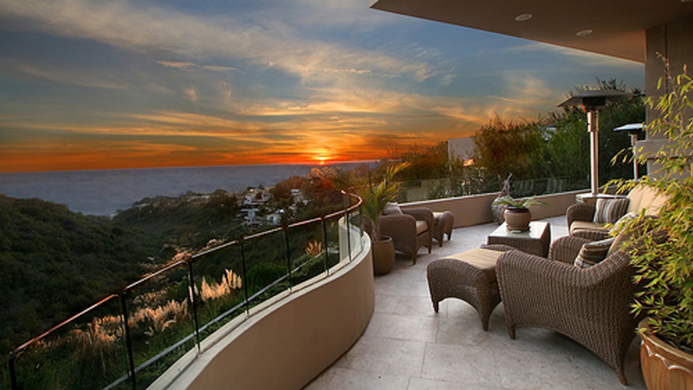 Sunset Serenity: Ocean Views from a Cozy Beach Balcony