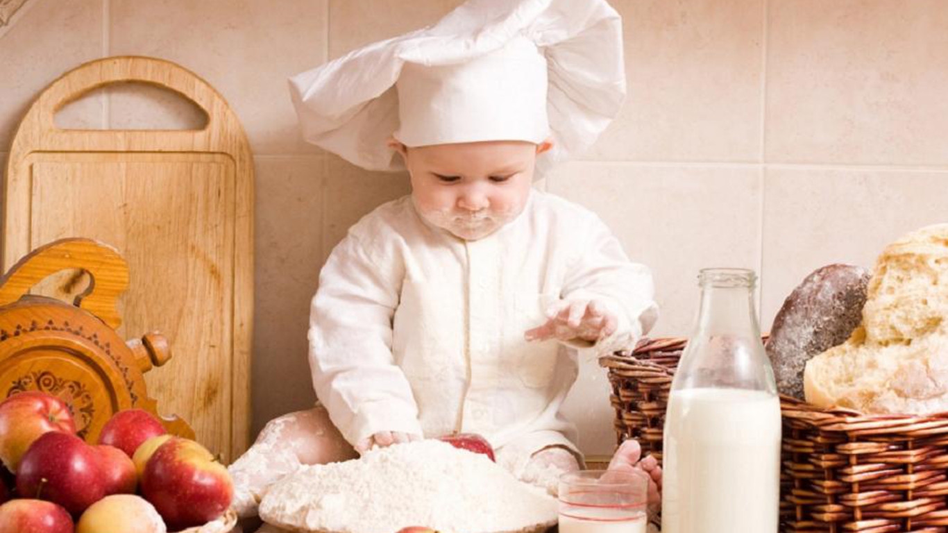 Little Chef’s Floury Fumble: A Playful Moment in Childhood Photography