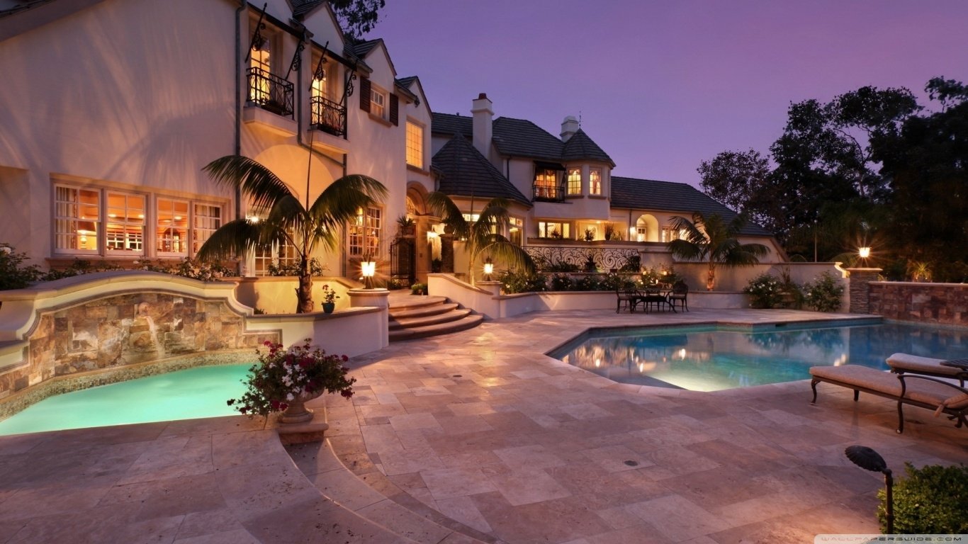 Elegant Man-Made Oasis: Luxurious House and Pool at Dusk