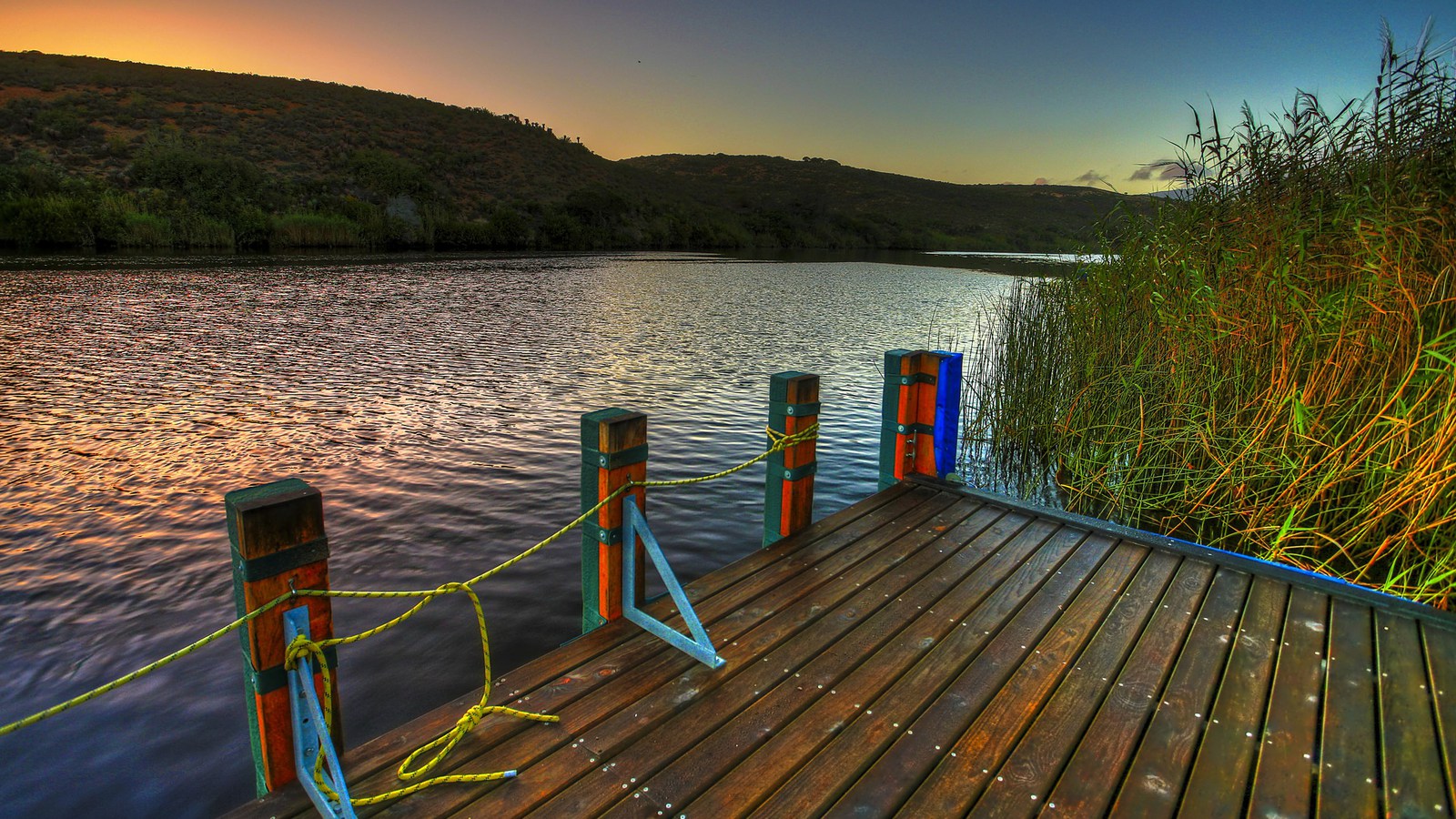 Serene Lake Bay at Dusk: A Dockside Photography Moment