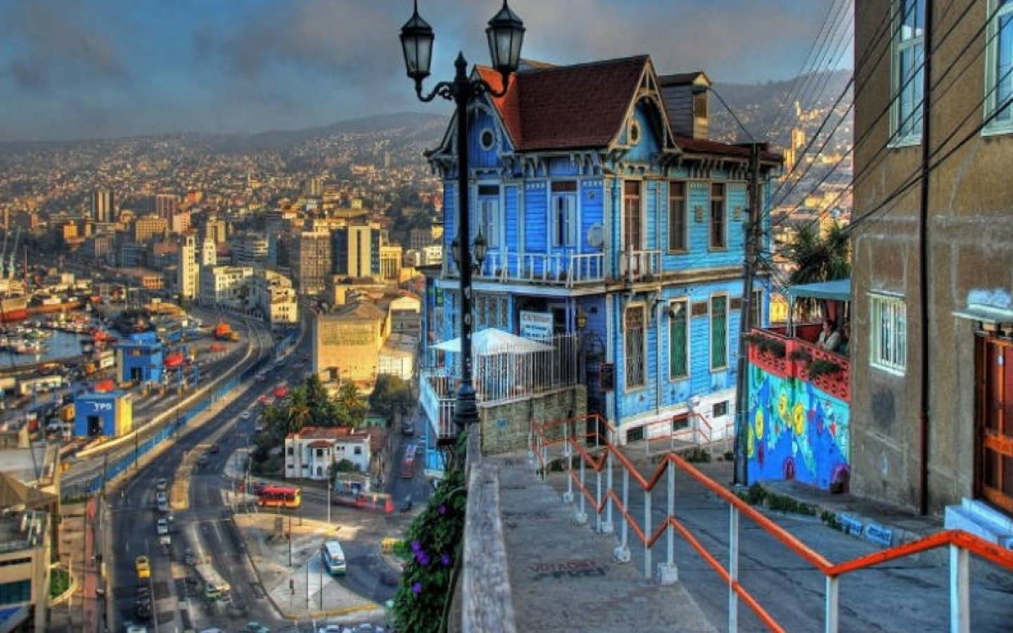 Colorful Cityscape: Blue House Overlooking the Urban Road