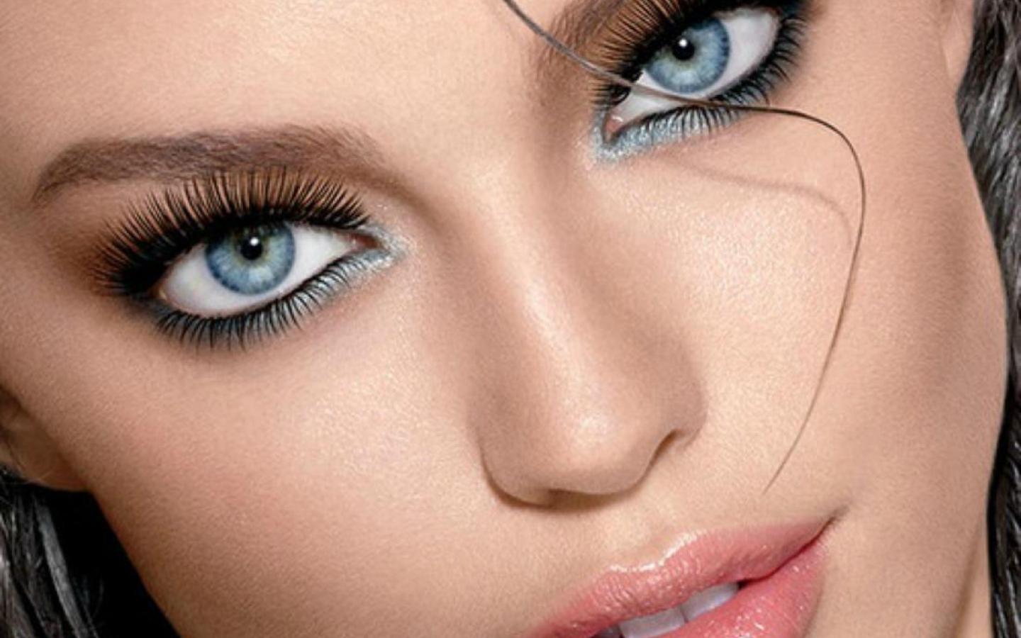 Close-Up of a Woman with Striking Blue Eyes